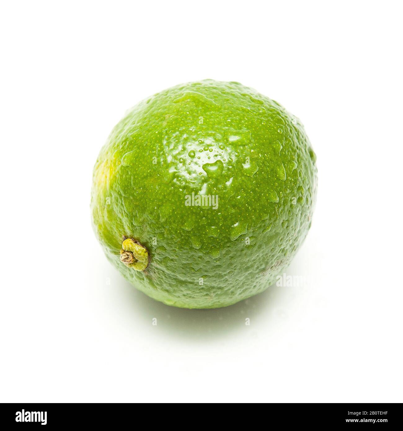 Fresh lime isolated on white Stock Photo - Alamy