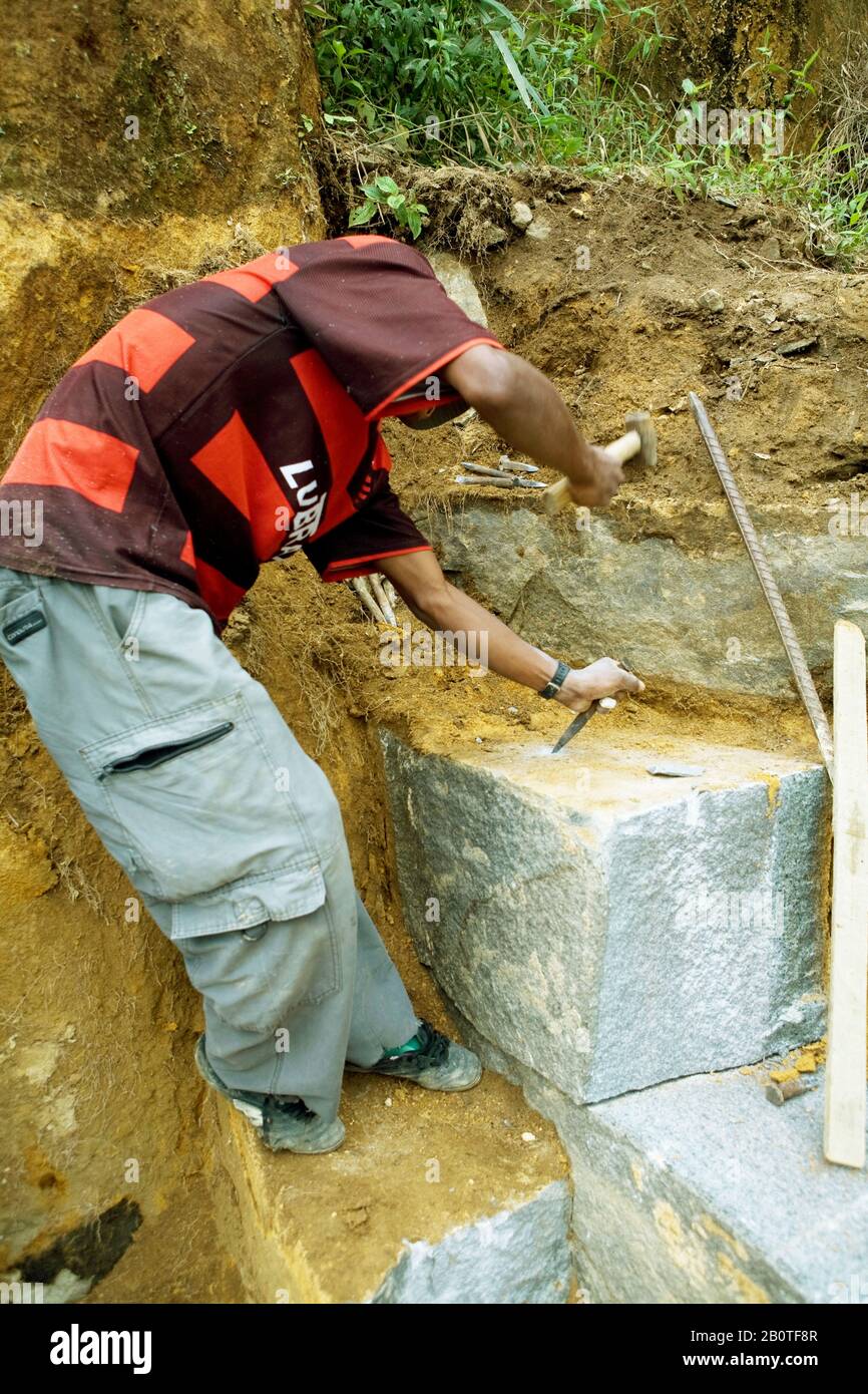 Person Breaking Block of Granite, Boa Nova, Bahia, Brazil Stock Photo ...