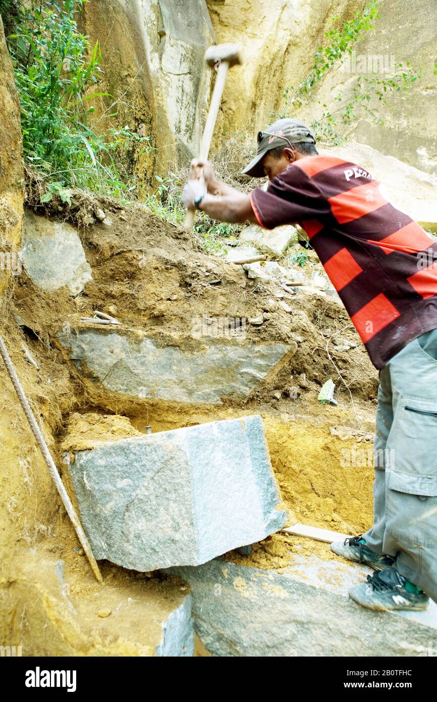 Person Breaking Block of Granite, Boa Nova, Bahia, Brazil Stock Photo ...