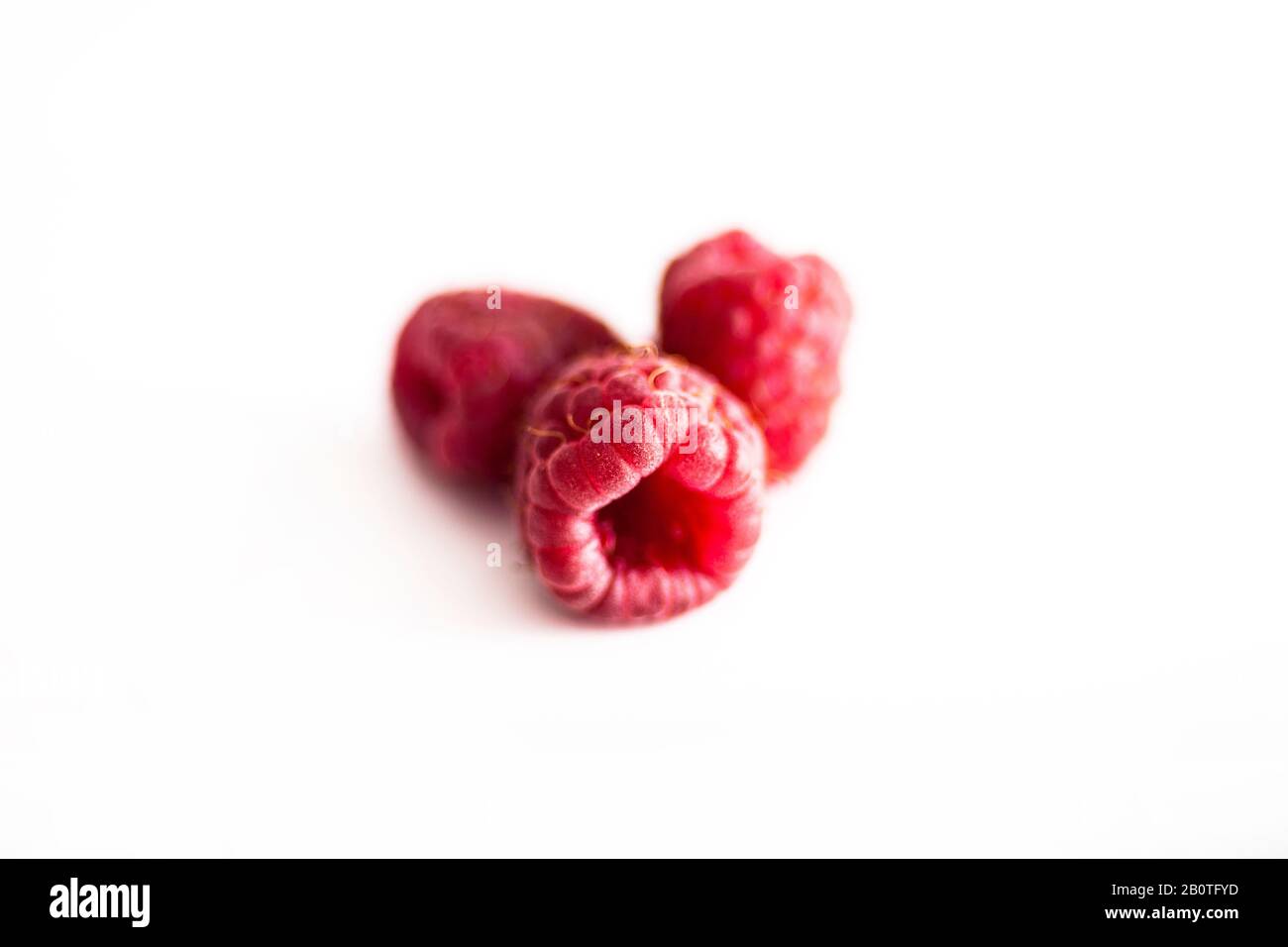 Ripe raspberry isolated on white background Stock Photo - Alamy