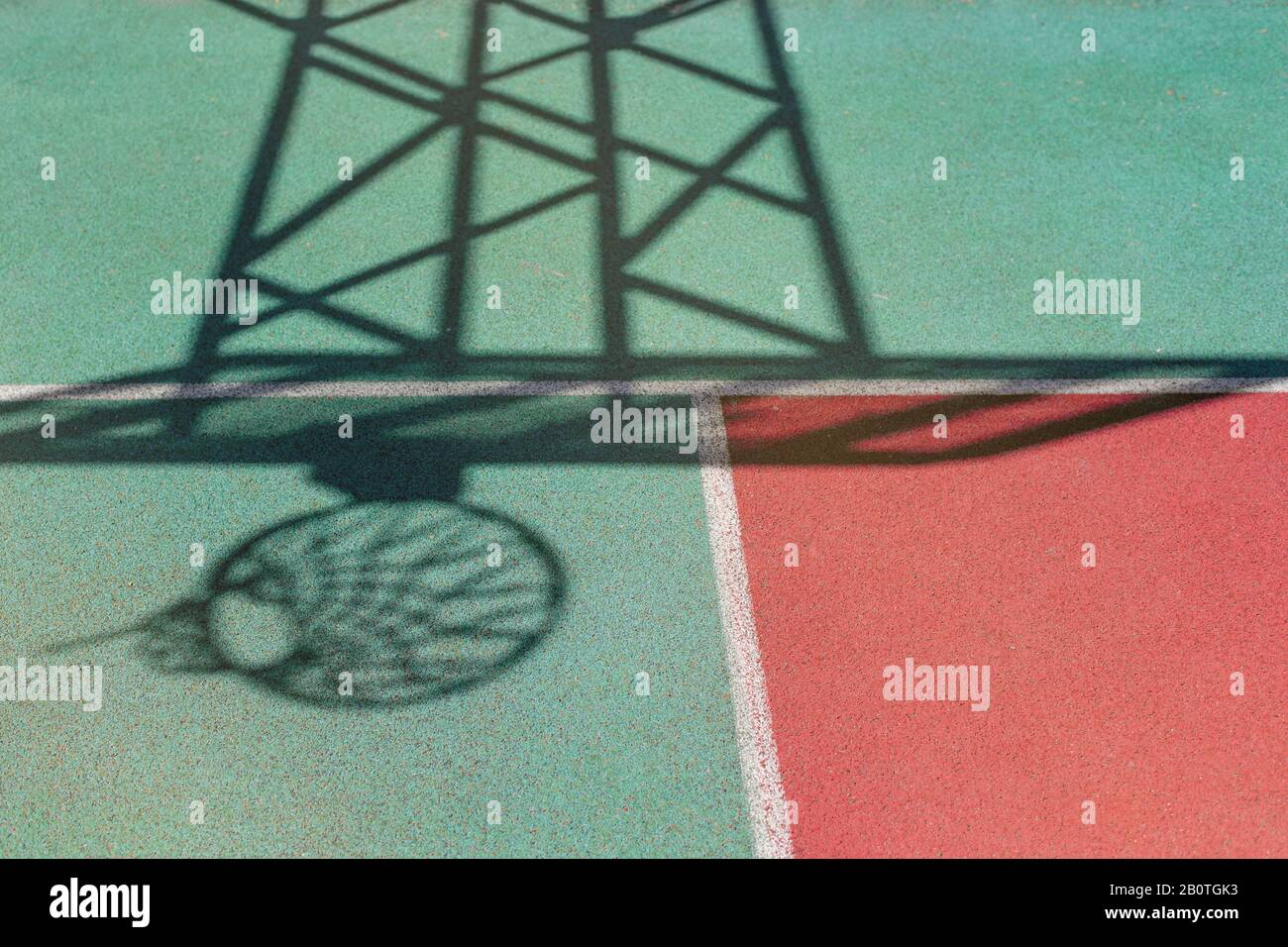 Shadow of basketball hoop on the colorful court background Stock Photo ...
