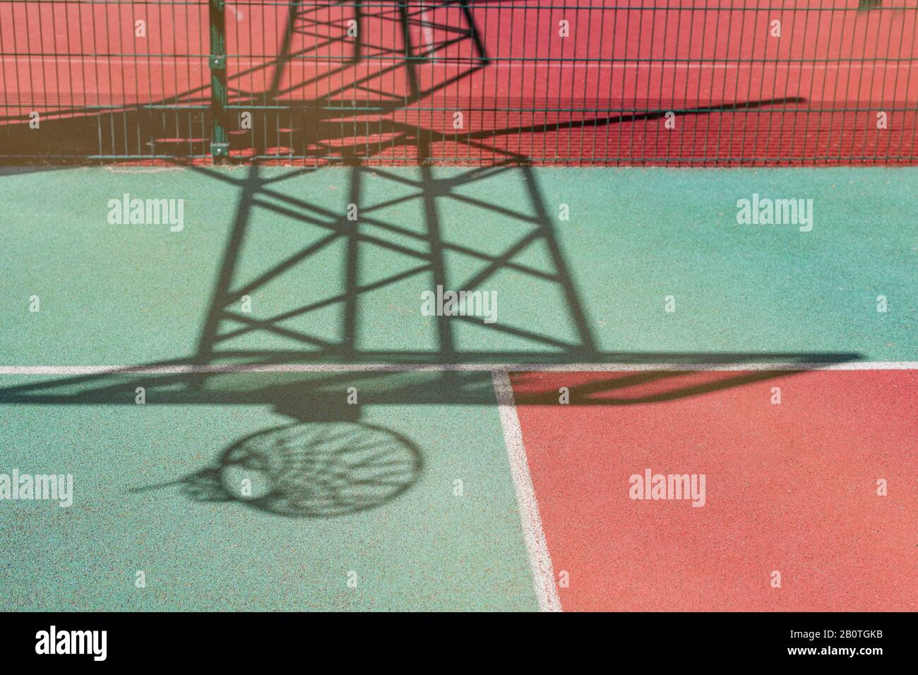 Shadow of basketball hoop on the colorful court background Stock Photo ...