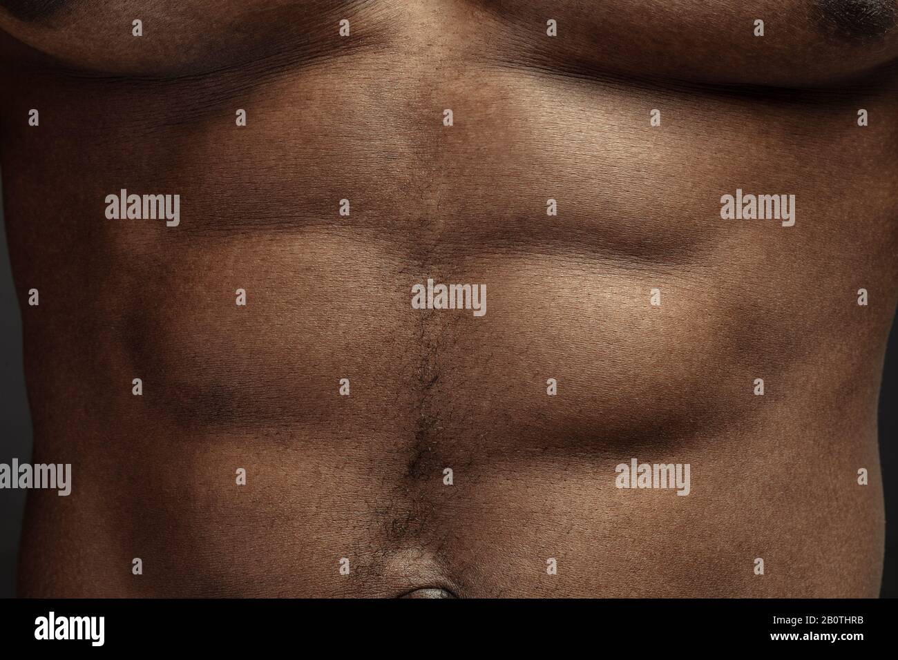 Belly. Detailed texture of human skin. Close up shot of young african ...
