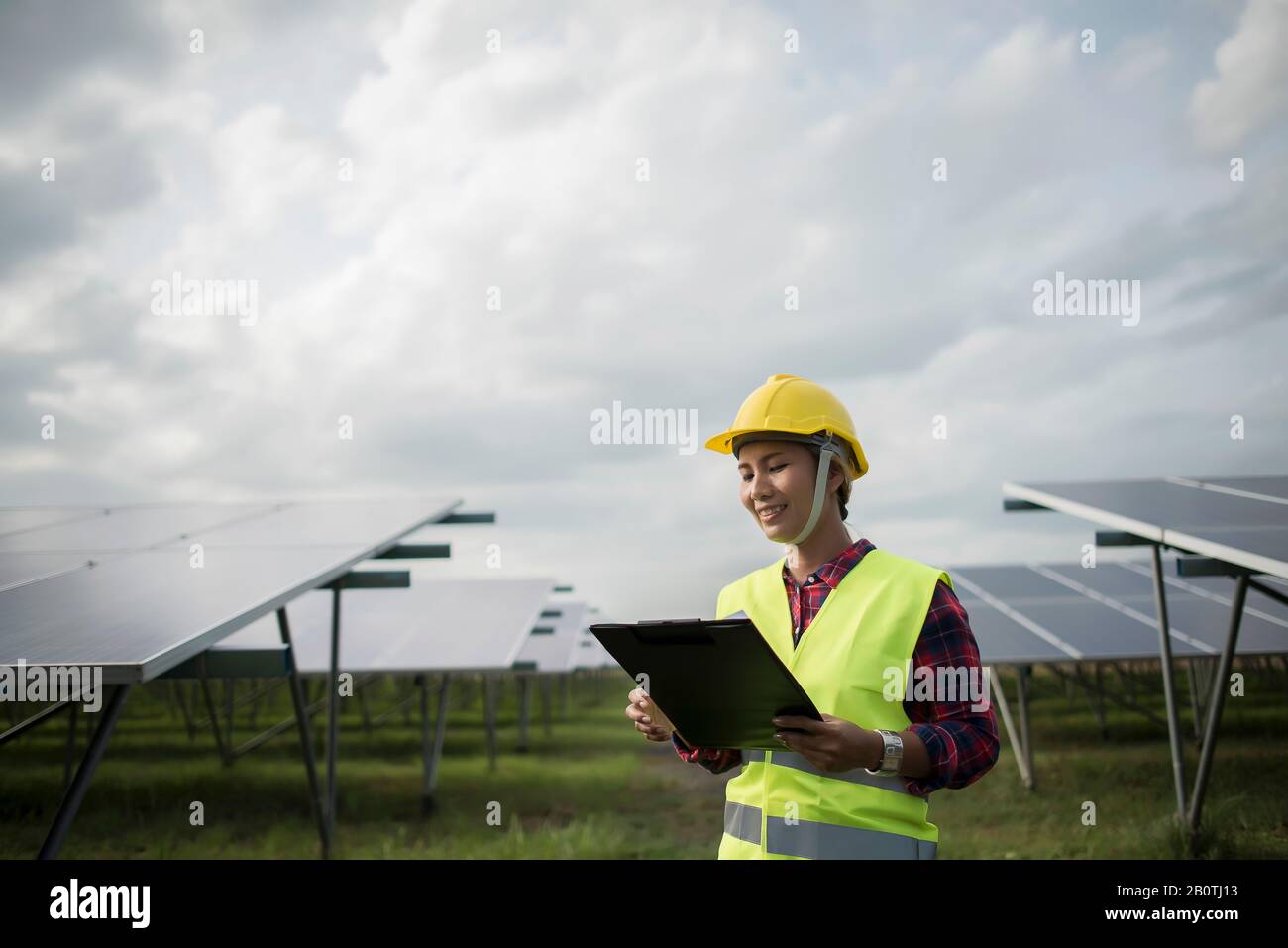 Engineer electric woman checking and maintenance of solar cells Stock ...