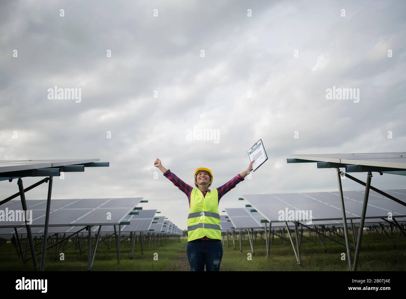 Engineer electric woman checking and maintenance of solar cells Stock ...
