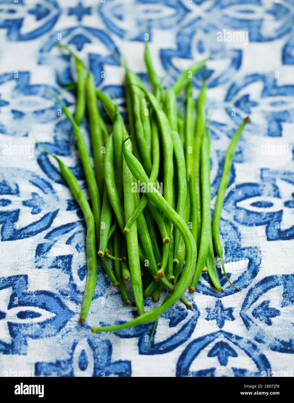 Green beans on blue and white background. Top view. Close up Stock ...