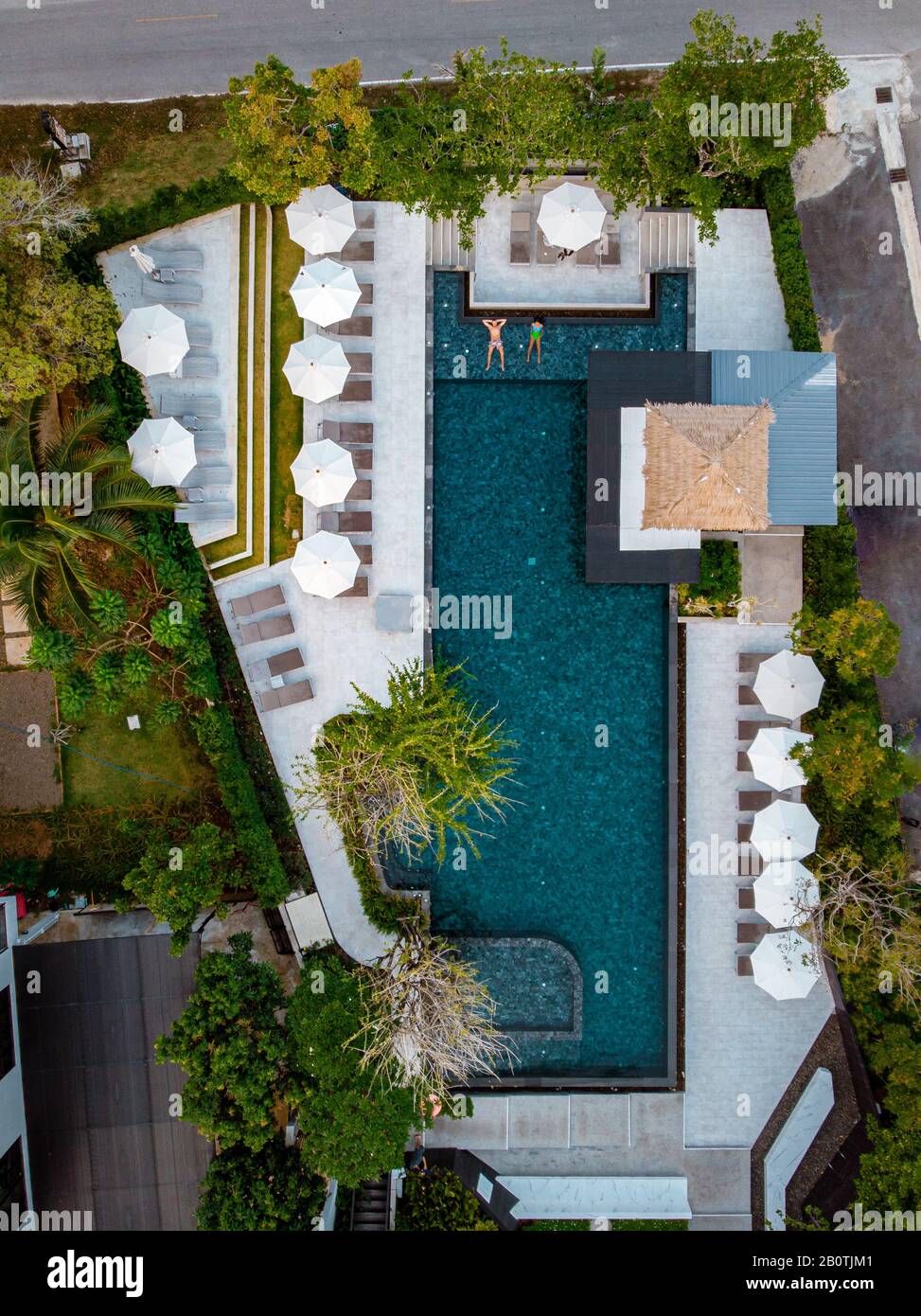 top view swimming pool, drone view pool, couple in swimming pool during ...