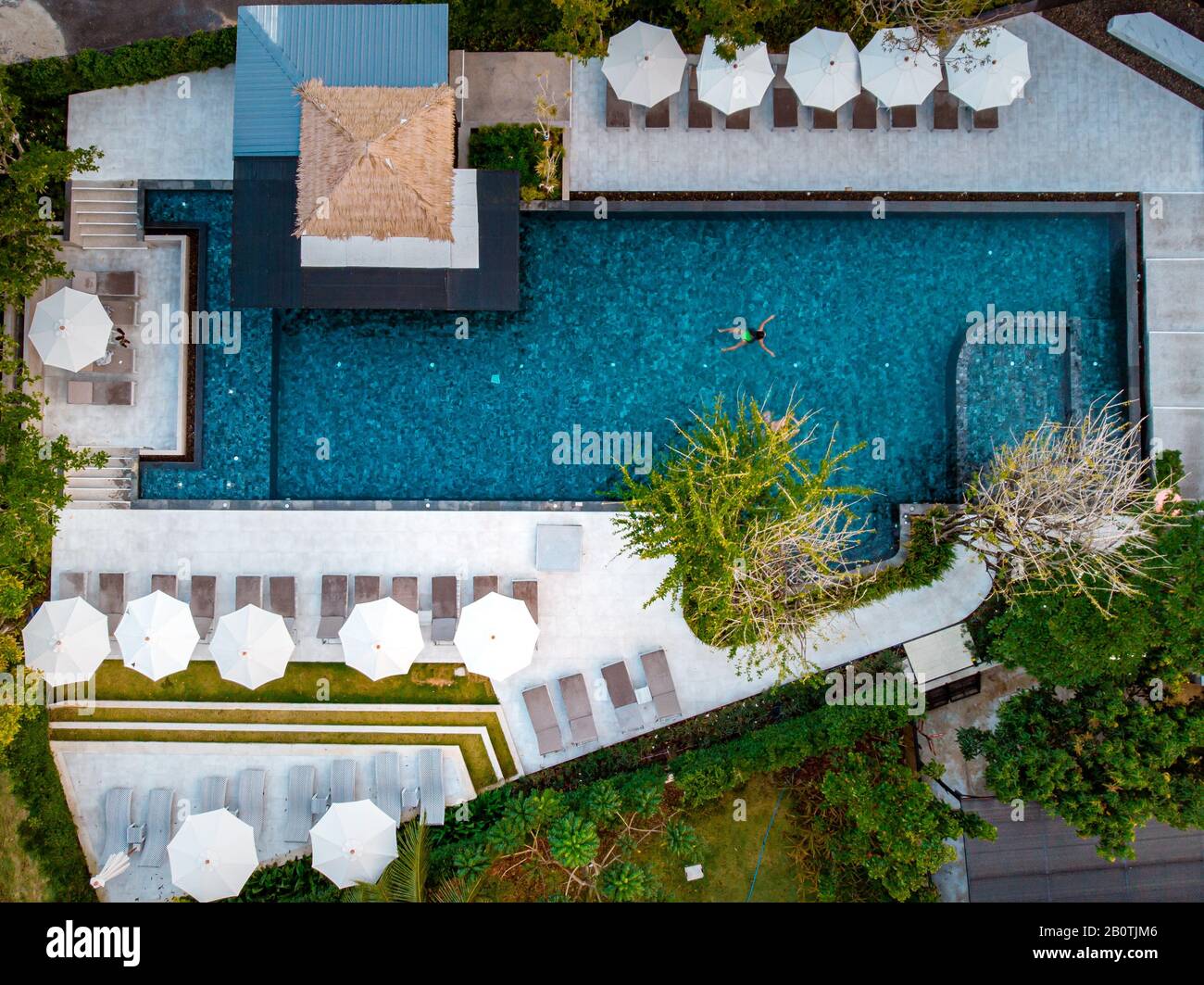 top view swimming pool, drone view pool, couple in swimming pool during ...