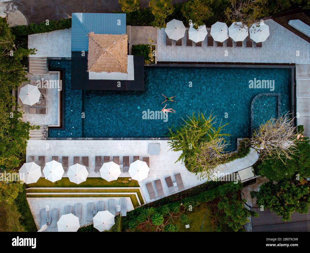 top view swimming pool, drone view pool, couple in swimming pool during ...