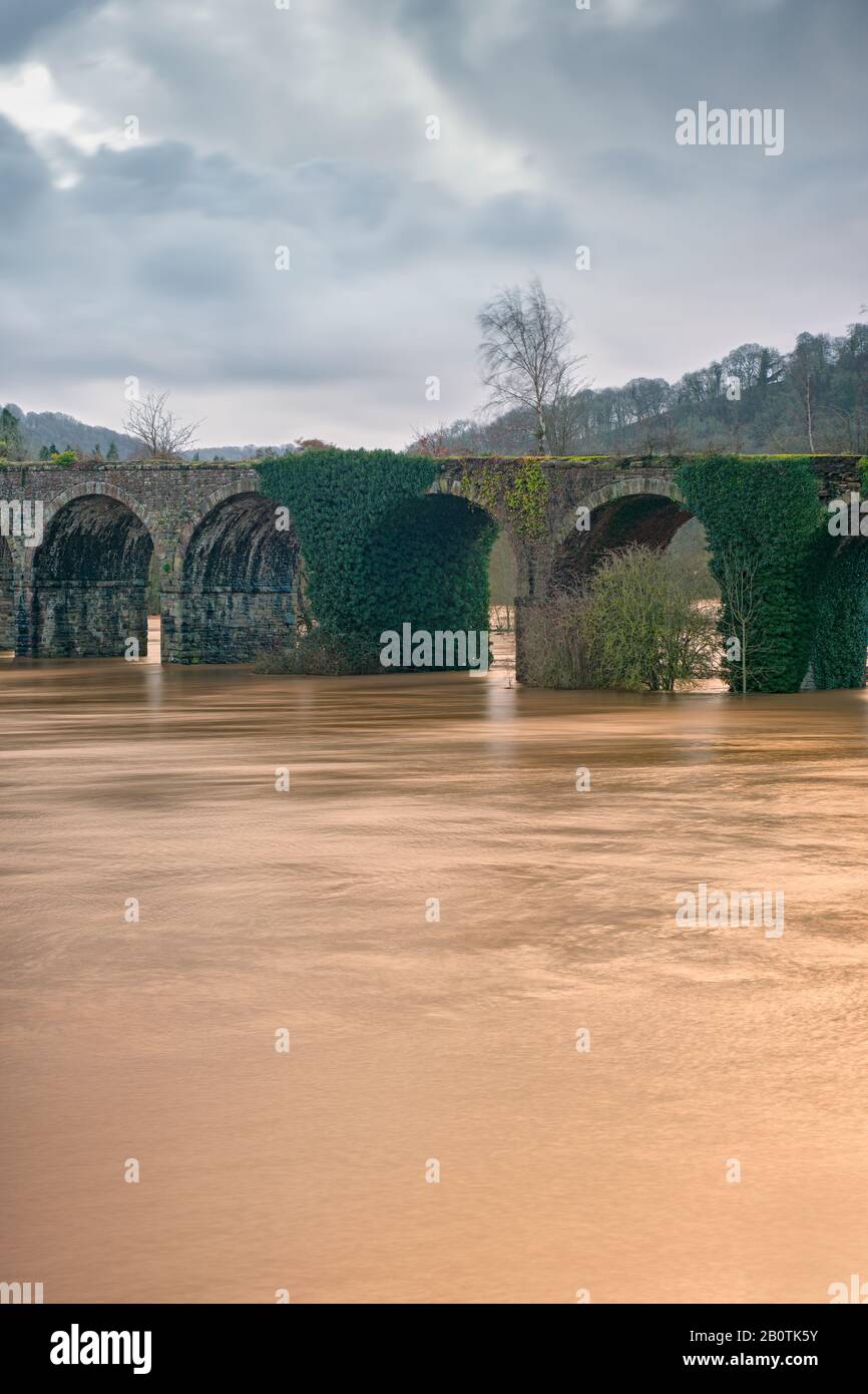 The historic Wye Valley rail viaduct at Monmouth surrounded by flood ...