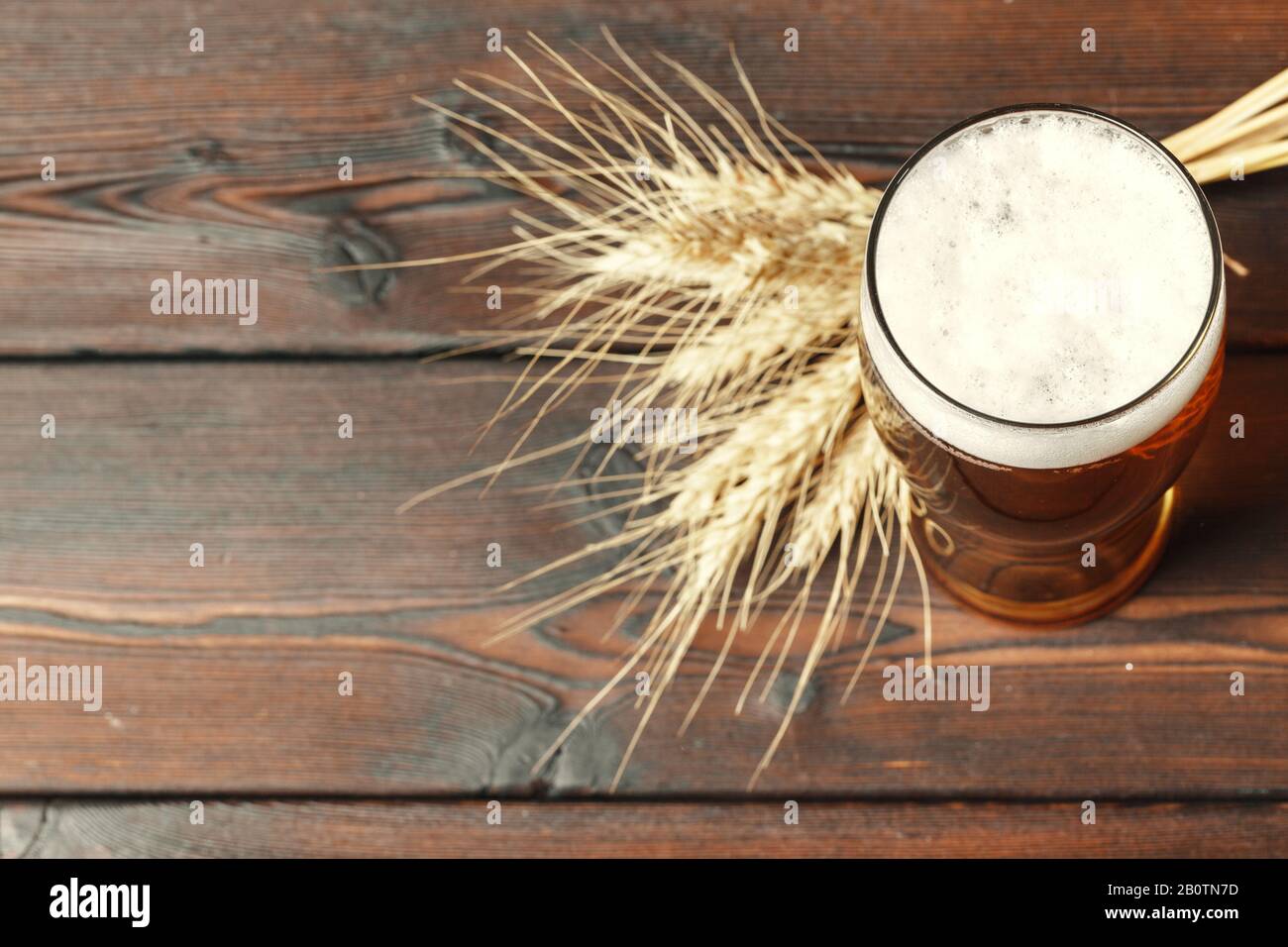 Glass beer on wood background. creative photo Stock Photo - Alamy