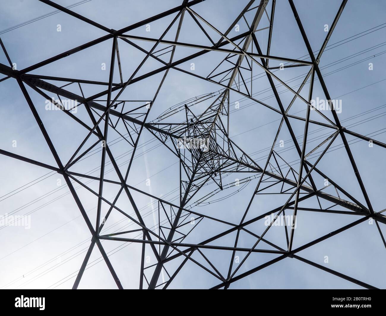 Electricity pylon abstract. Abstract view looking up at the ...