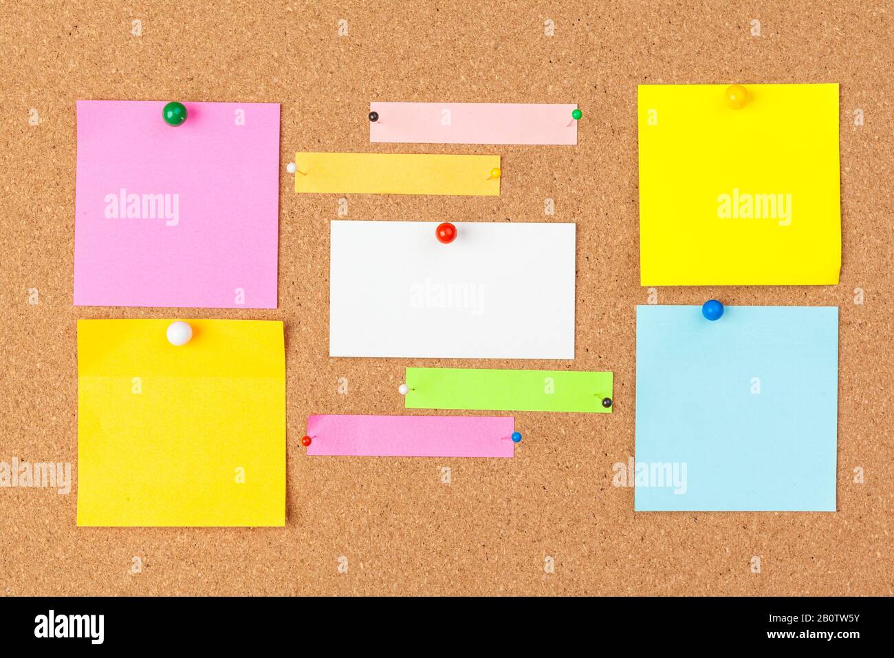 Cork board with several colorful blank notes with pins Stock Photo - Alamy