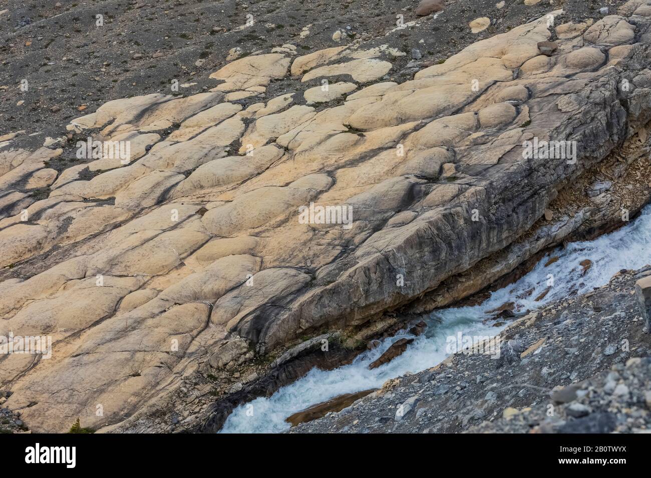 Stream emerging from Hargreaves Lake, passing bedrock scoured by ...