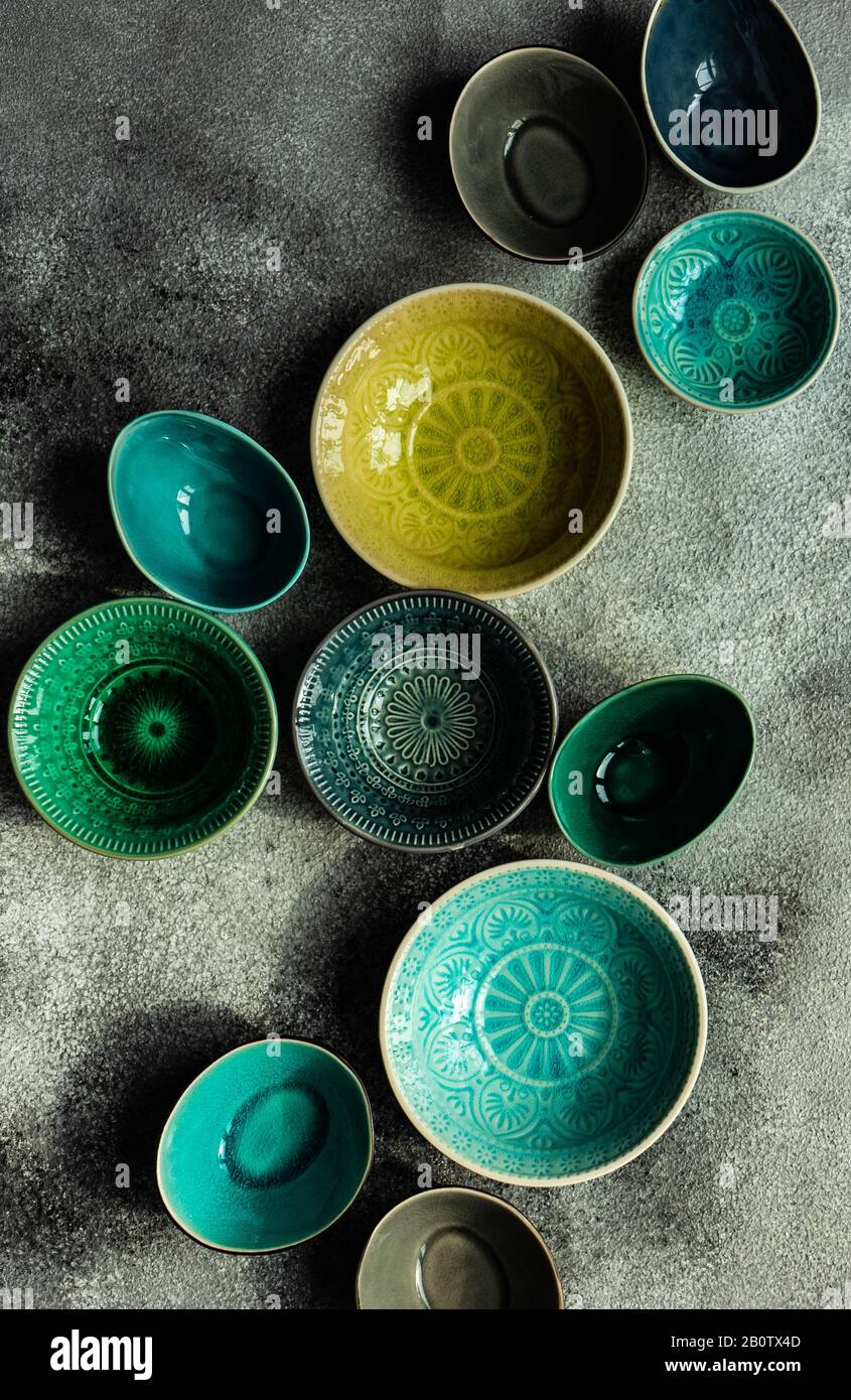 Empty ceramic bowls with pattern on stone background with copy space ...