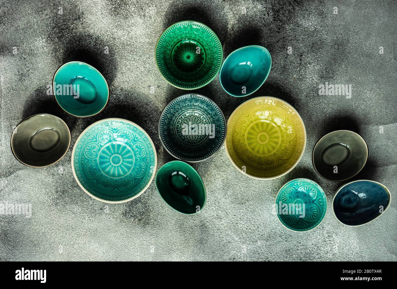 Empty ceramic bowls with pattern on stone background with copy space ...