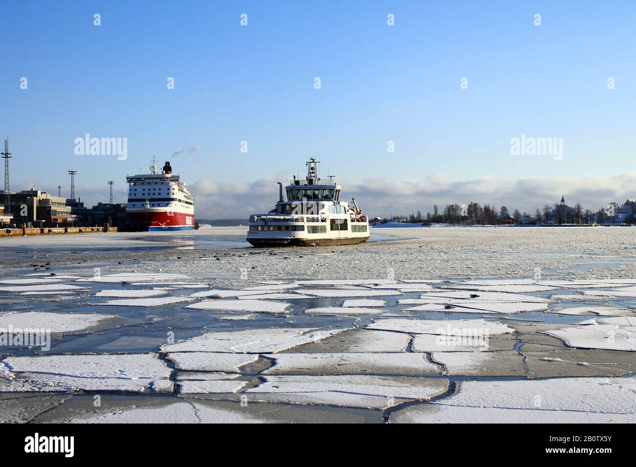 Ice pick in Helsinki port during winter Stock Photo - Alamy