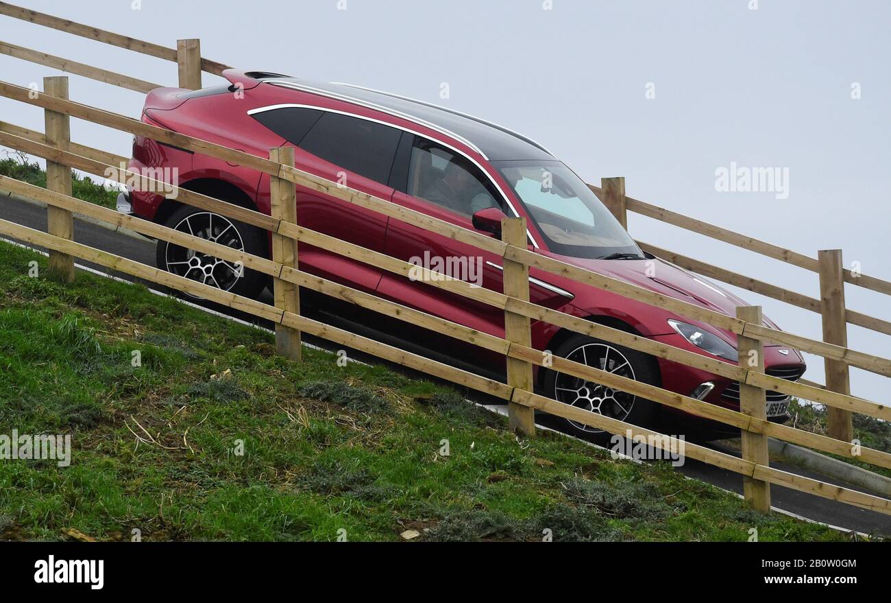 The Prince of Wales driving the new Aston Martin DBX during a visit at ...