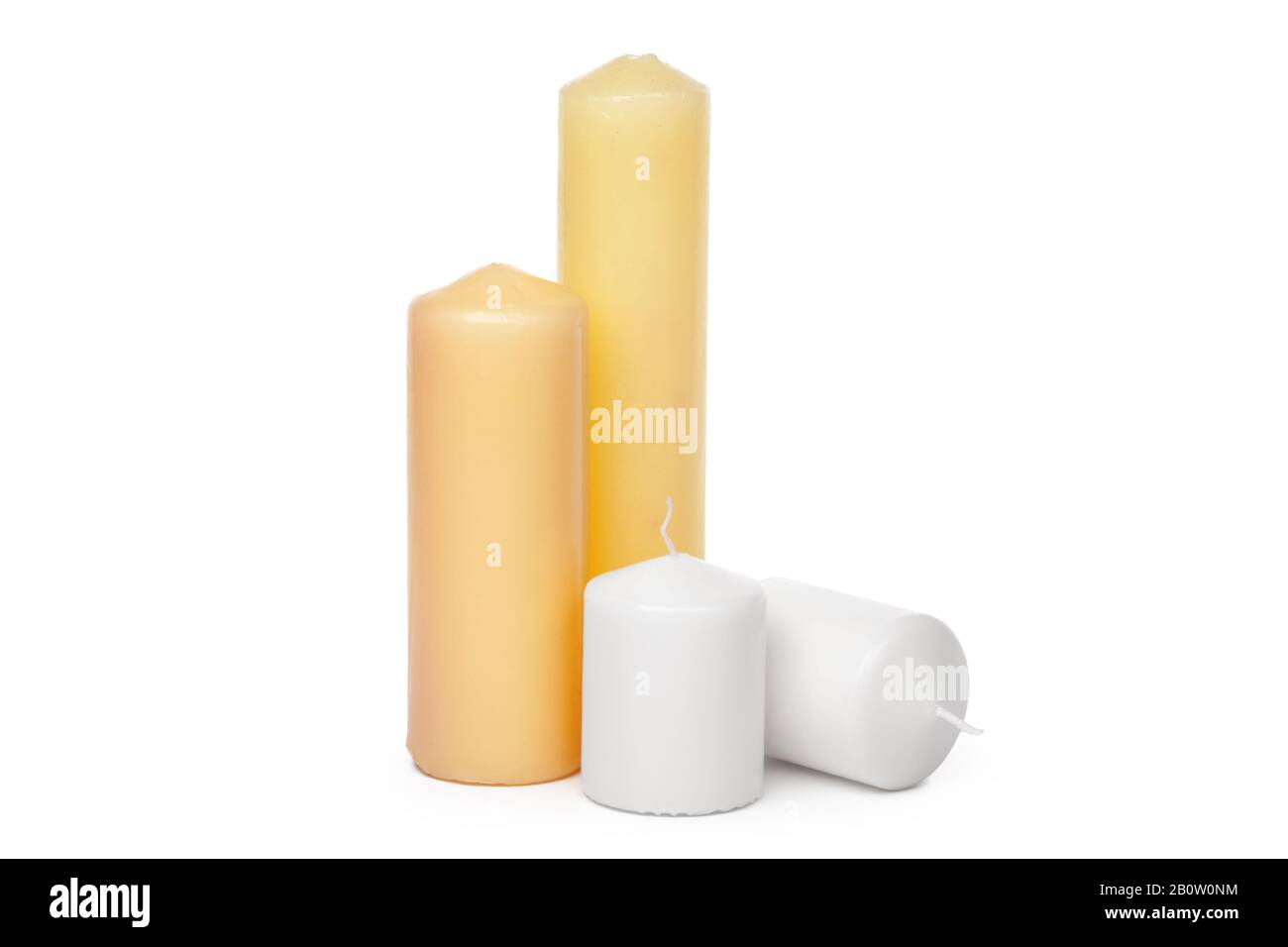 different sized candles on a white background Stock Photo - Alamy