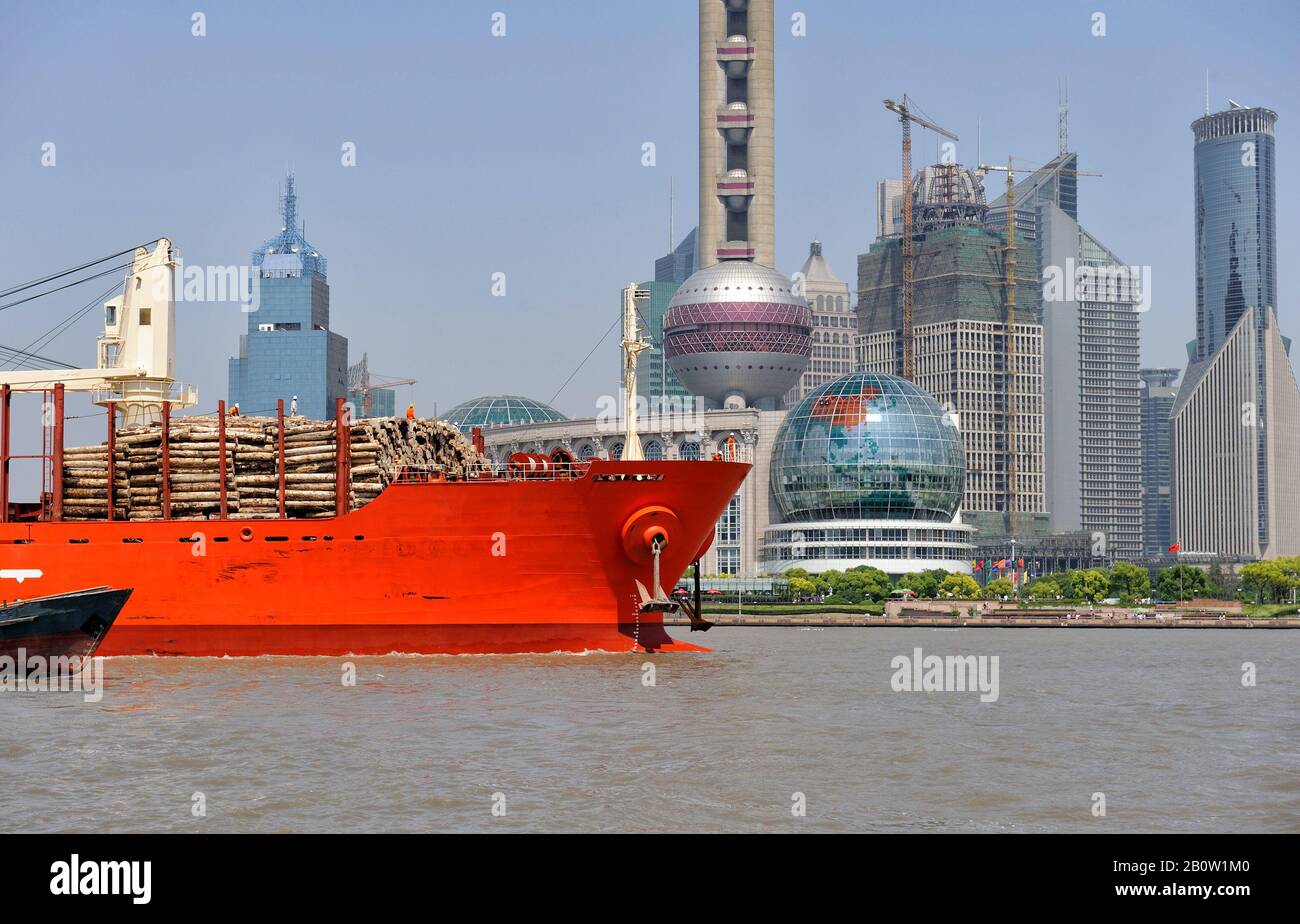 Commercial ships traffic on Huangpu river in front of financial center ...