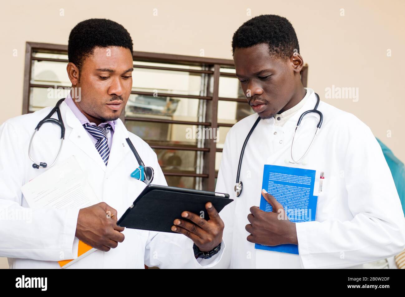 African doctor patient touch hi-res stock photography and images - Alamy