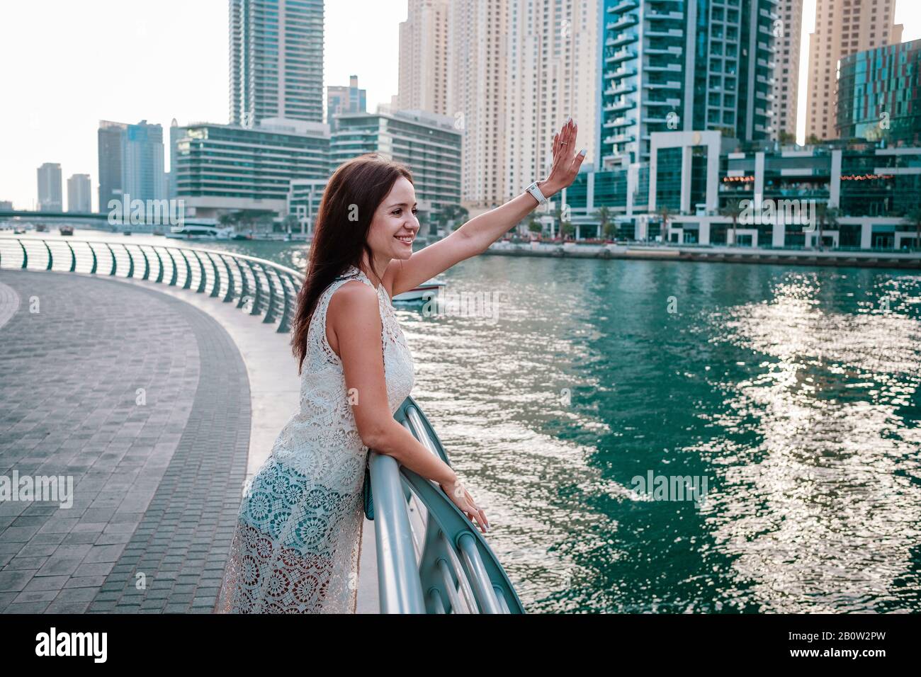 Enjoying travel in United Arabian Emirates. Happy young woman. Amazing ...