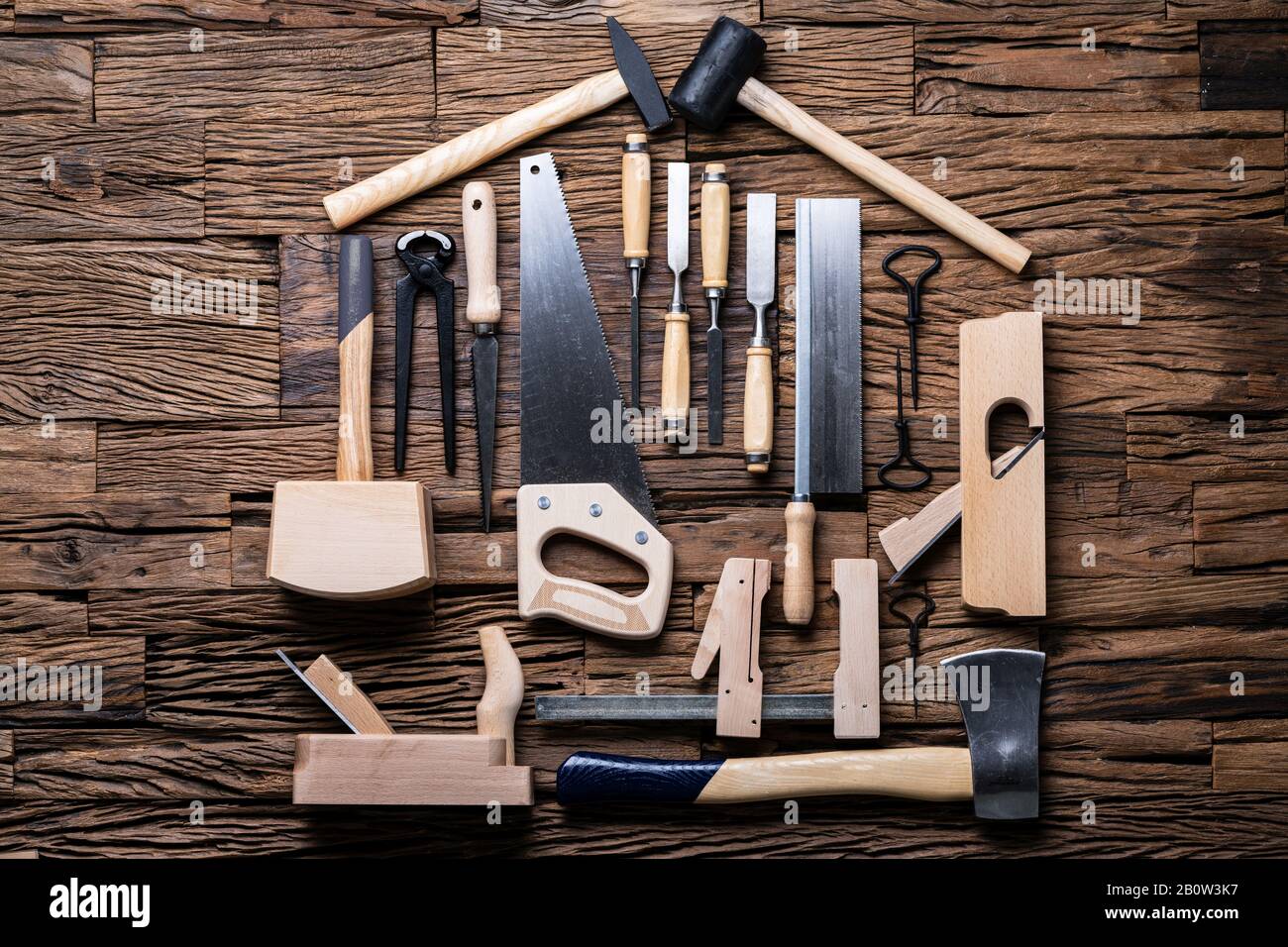 Various Carpenter Tools In House Shape Laying On Desk Stock Photo - Alamy
