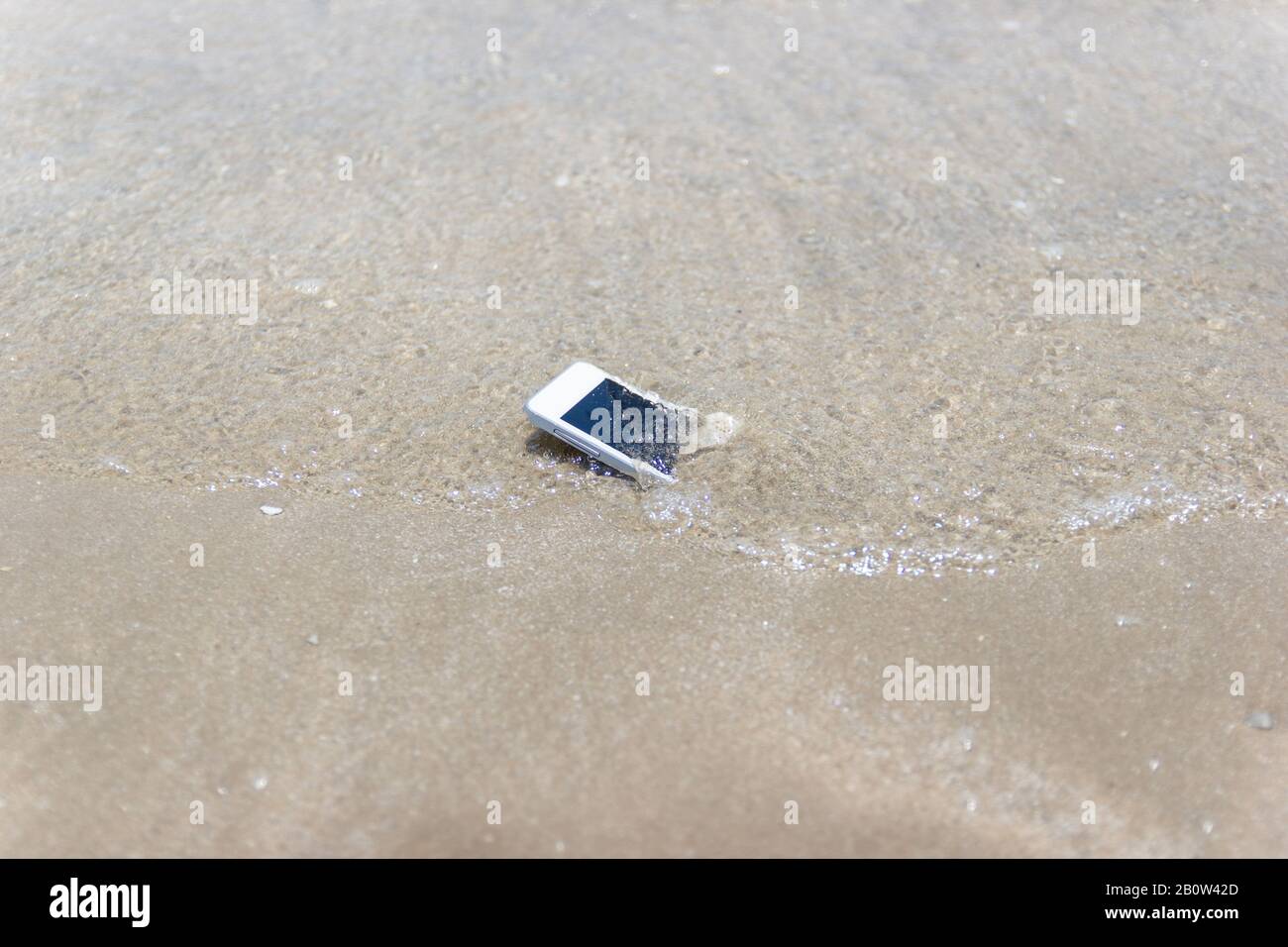 Mobile phone floated to the sea at the beach Stock Photo - Alamy