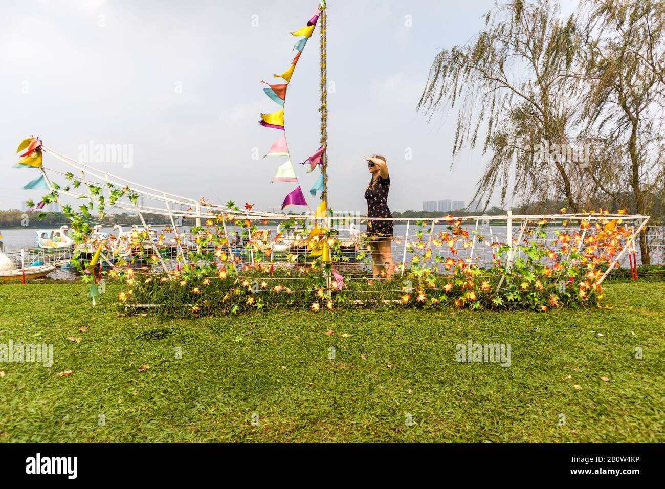 A captain woman in a flower ship in a beautiful park Stock Photo - Alamy