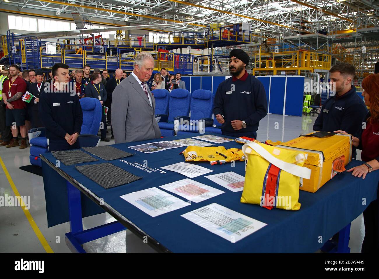 The Prince of Wales speaks with members of staff during a visit to the ...