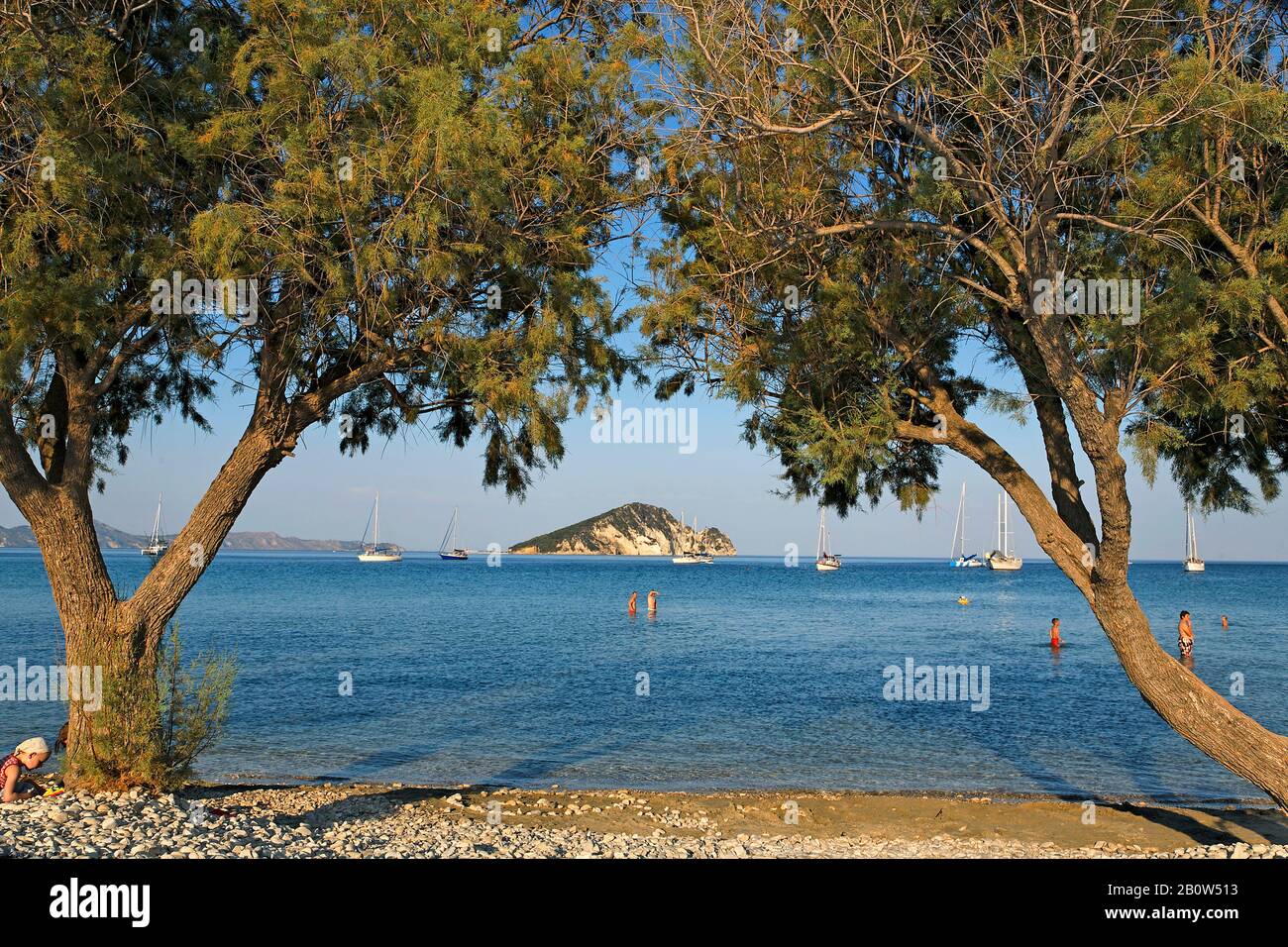 View from the beach Limni Keriou on tiny island Marathonissi, Zakynthos ...