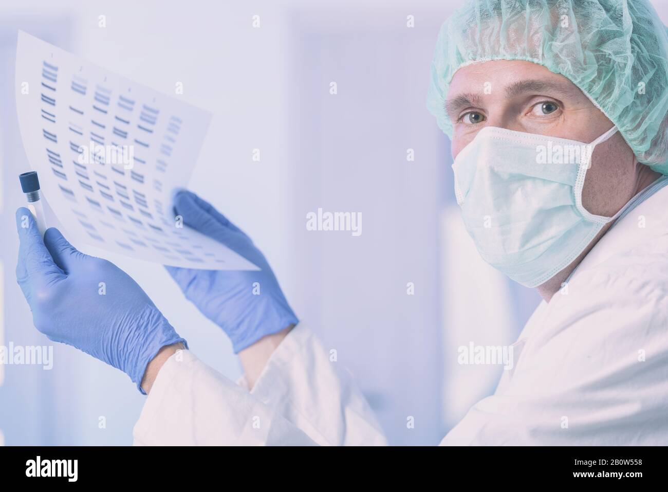 Scientist analizing DNA sequence in the modern laboratory Stock Photo ...