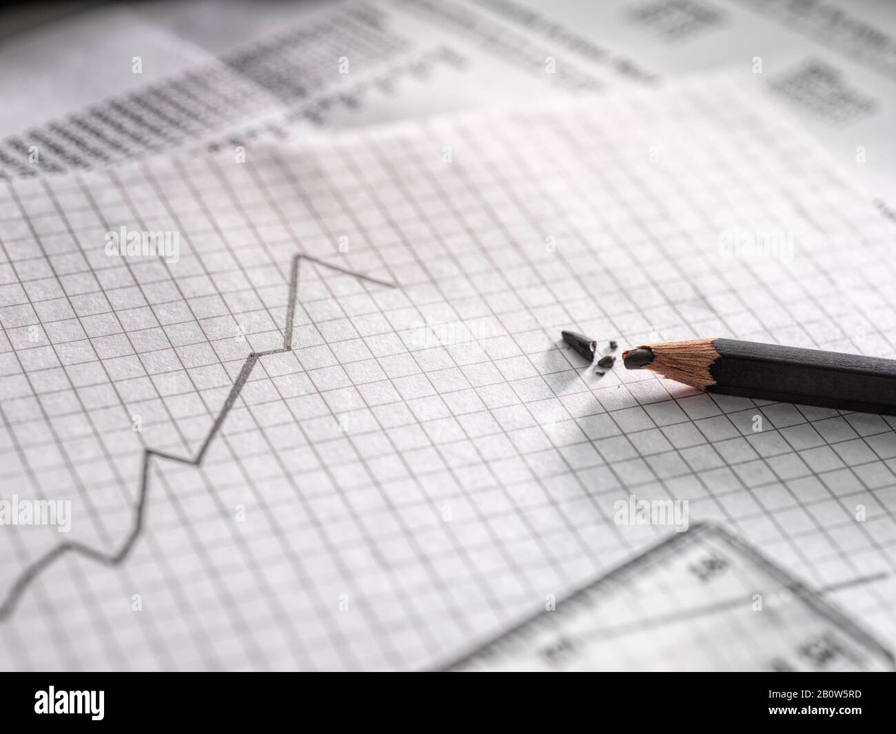 A graph illustrating business data, a line on a chart rising and ...