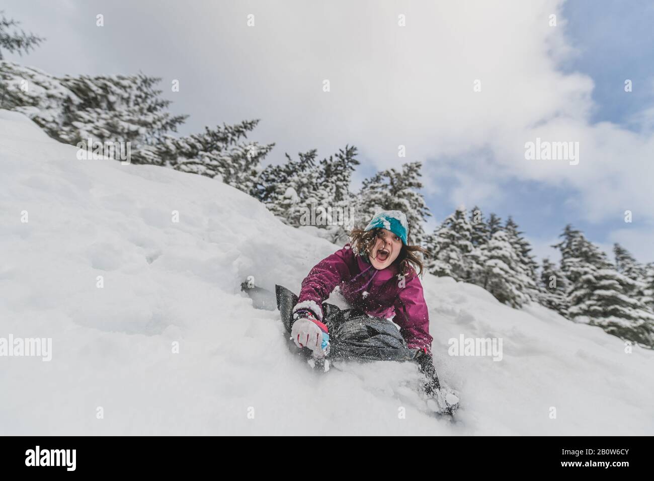 Sliding down snow slope hi-res stock photography and images - Alamy