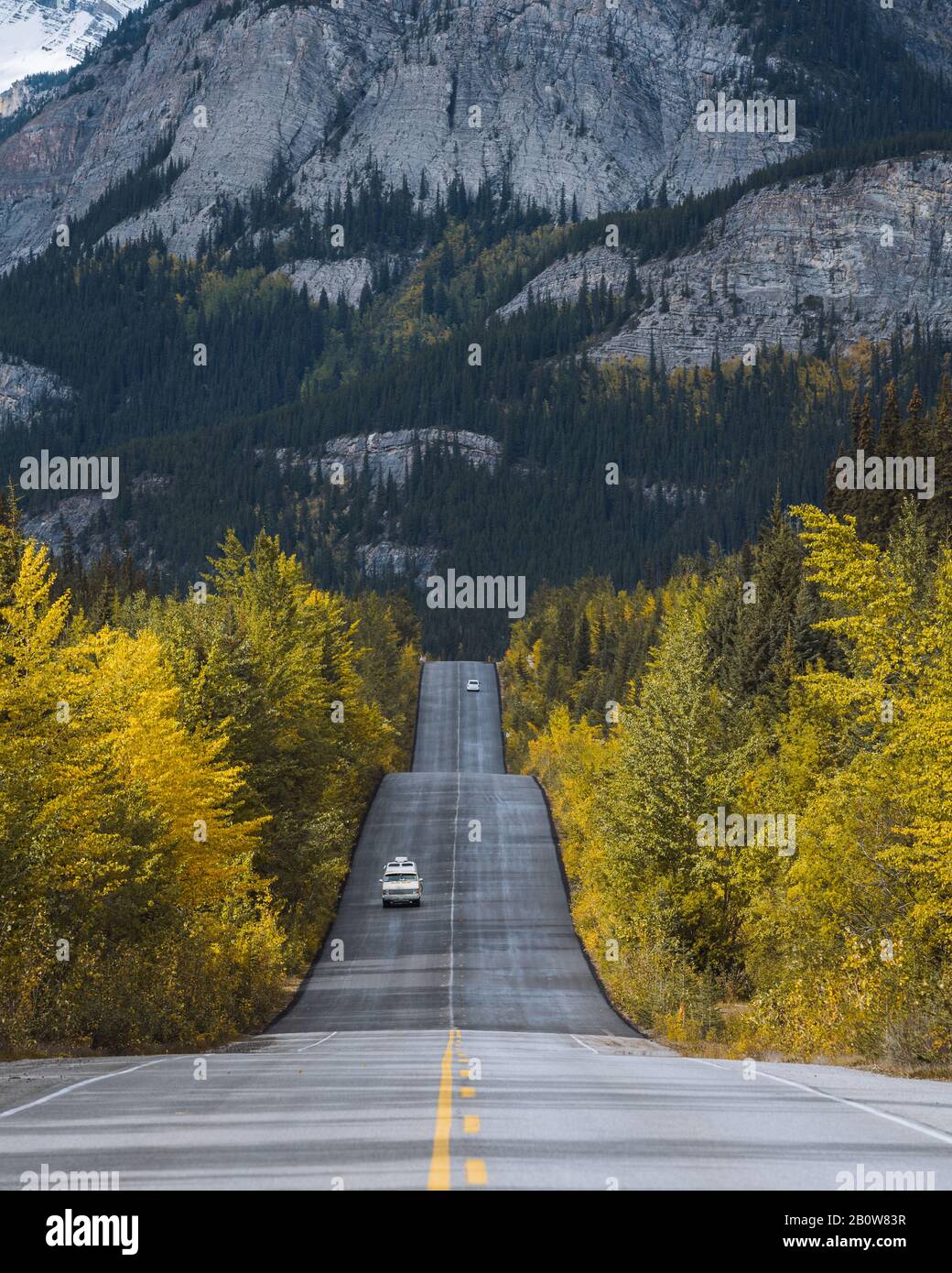 Campervan driving through Icefields Parkway in fall, Alberta, Canada ...