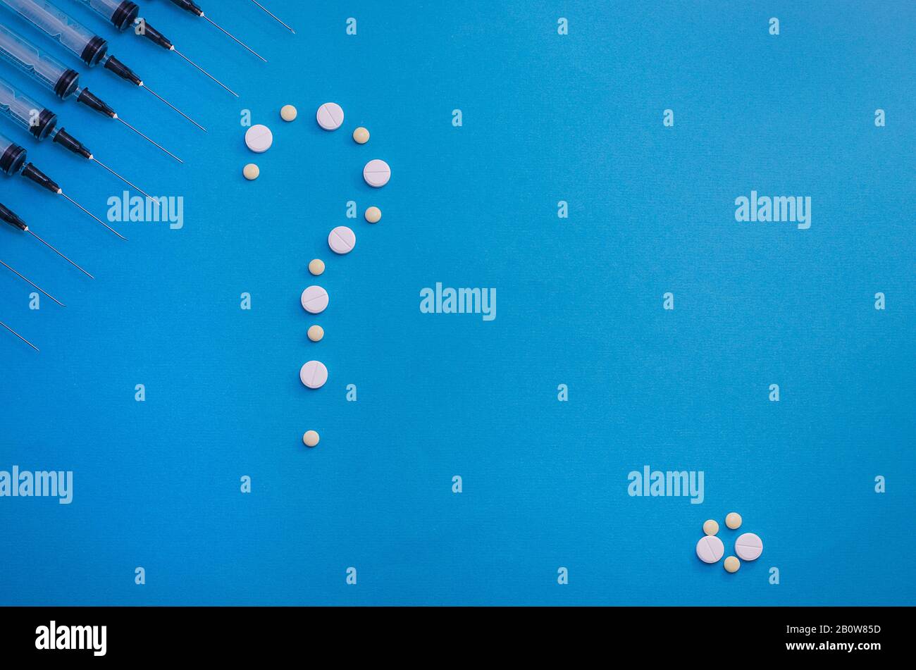 Pills and syringes with question mark hi-res stock photography and ...