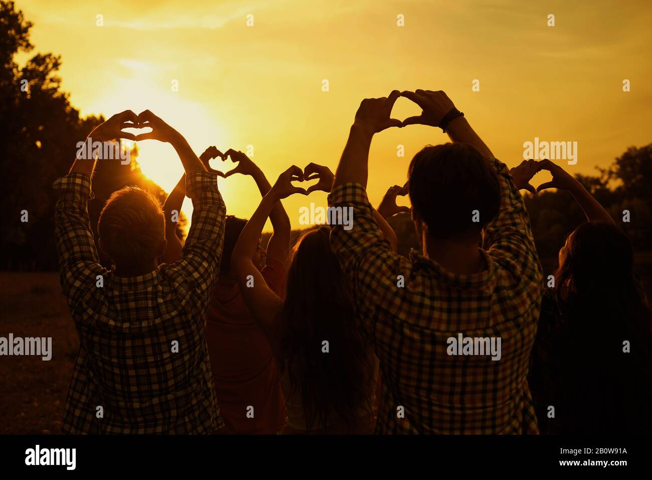 Group of people making heart symbol hi-res stock photography and images ...
