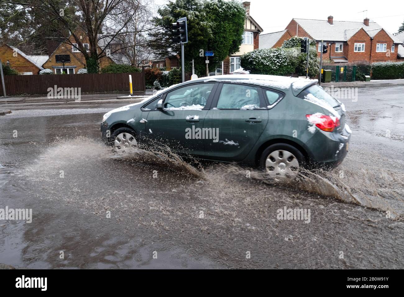 vehicle through a large puddle Stock Photo - Alamy