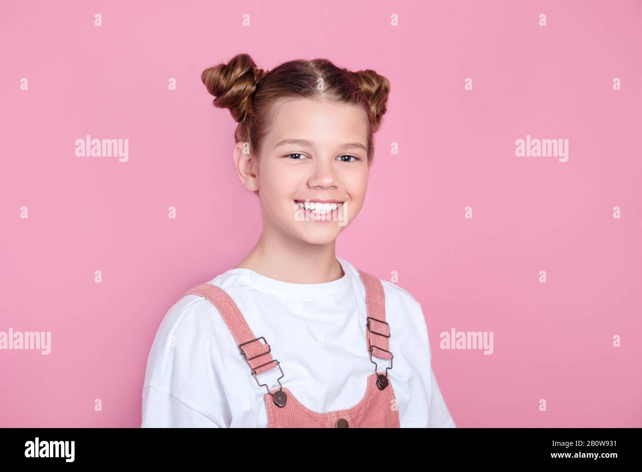 Bright laughing teenage girl on pink studio background Stock Photo - Alamy