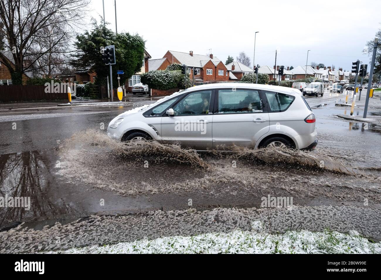 vehicle through a large puddle Stock Photo - Alamy