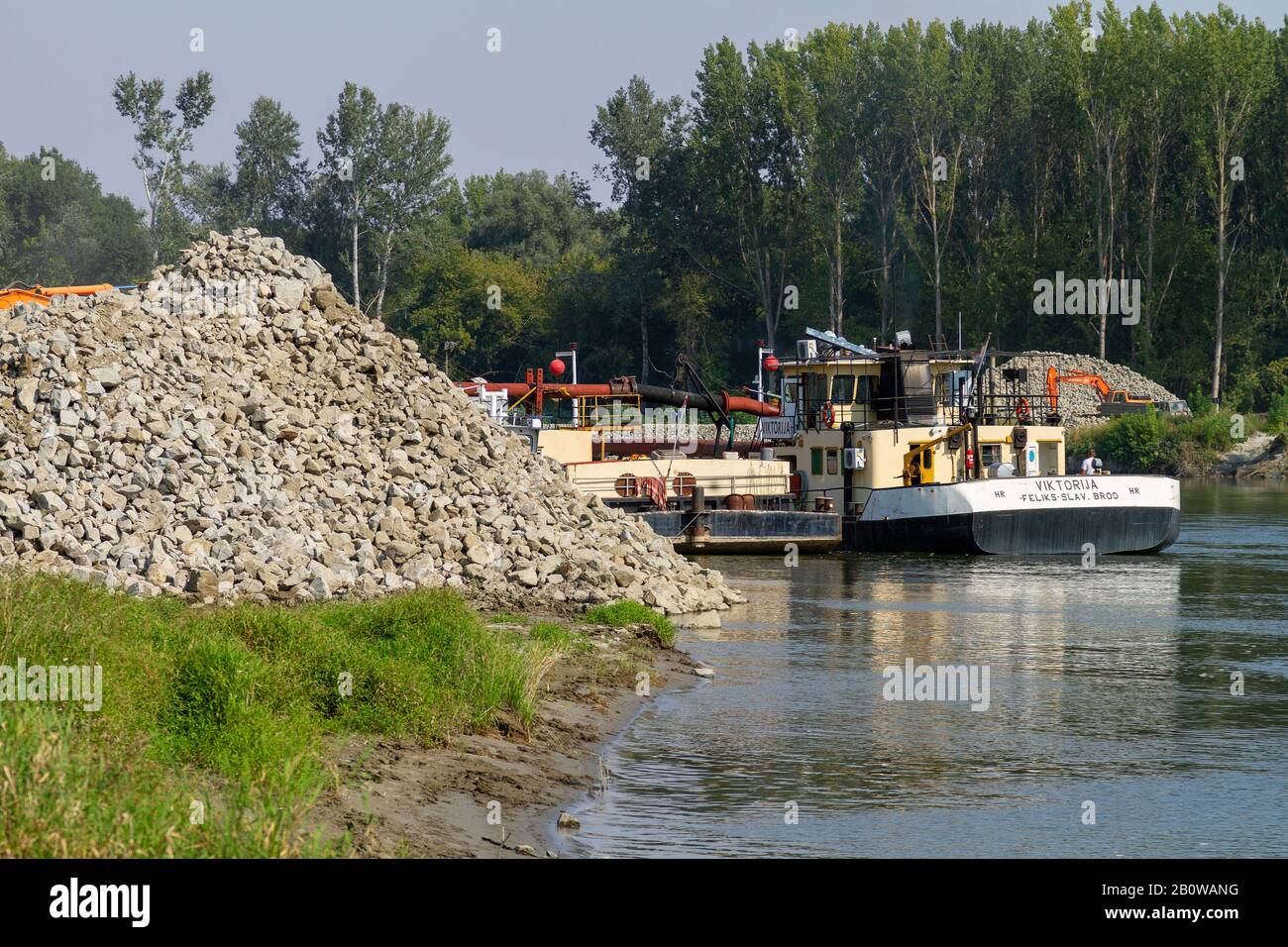 Construction of the riprap embankment on the Drava River Stock Photo ...