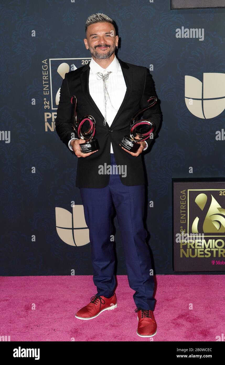 MIAMI, FLORIDA - FEBRUARY 20: Pedro Capo poses backstage during ...