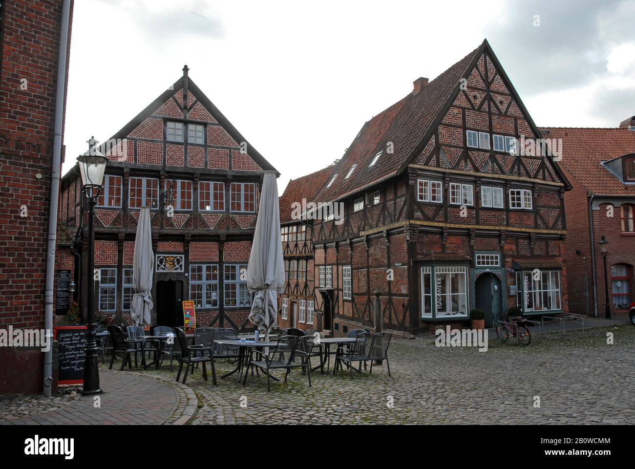 A few medieval buildings around a small cobbled-stone square, mostly ...
