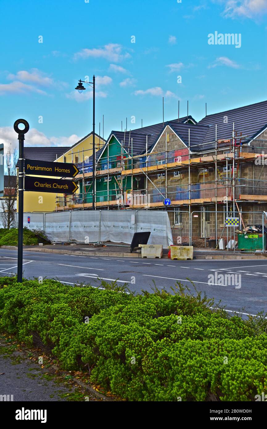Nearly completed new timber-framed homes at a Persimmon building site ...