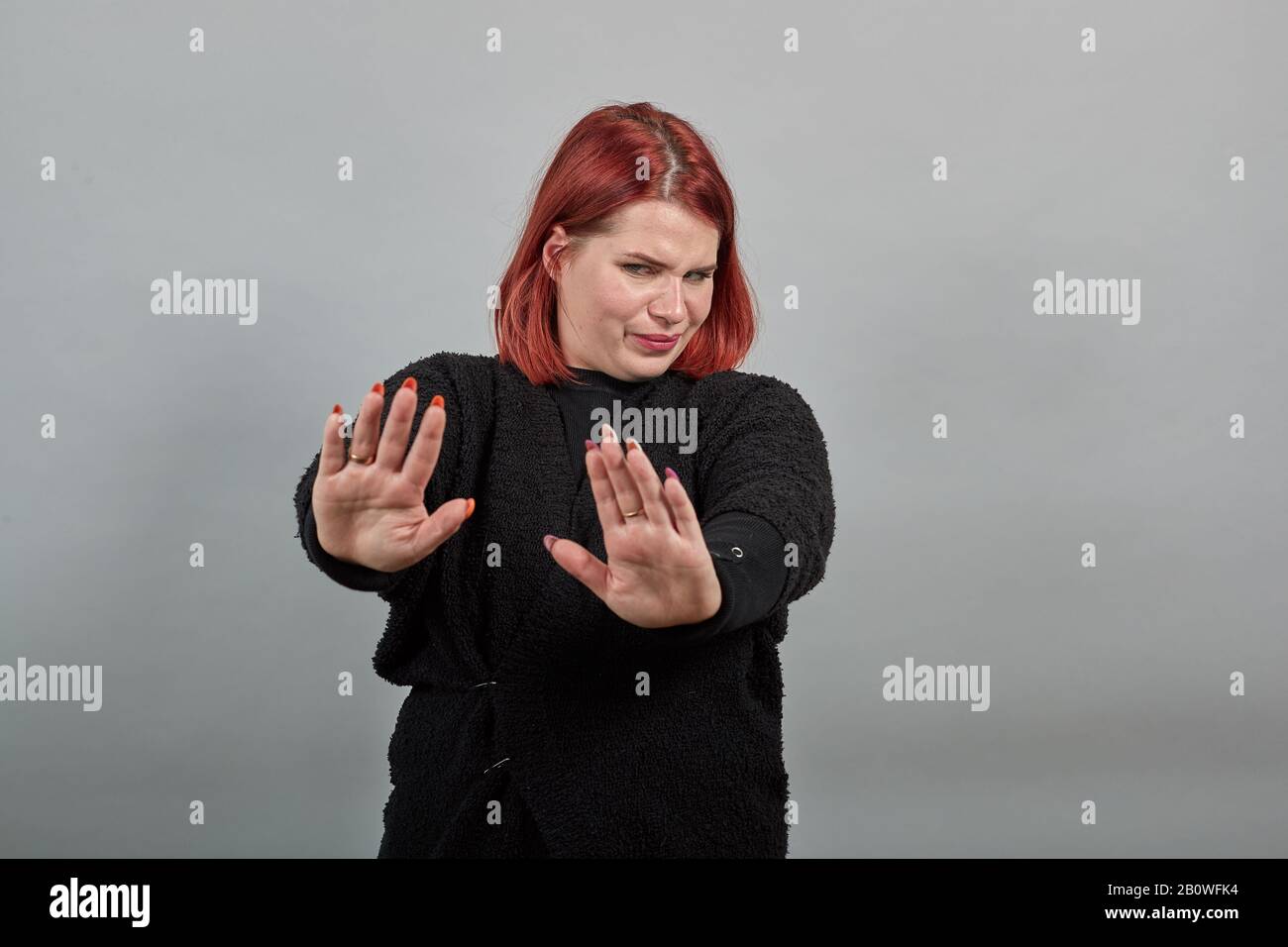 fat lady offended woman shows stop sign with her hands, no, shows ...