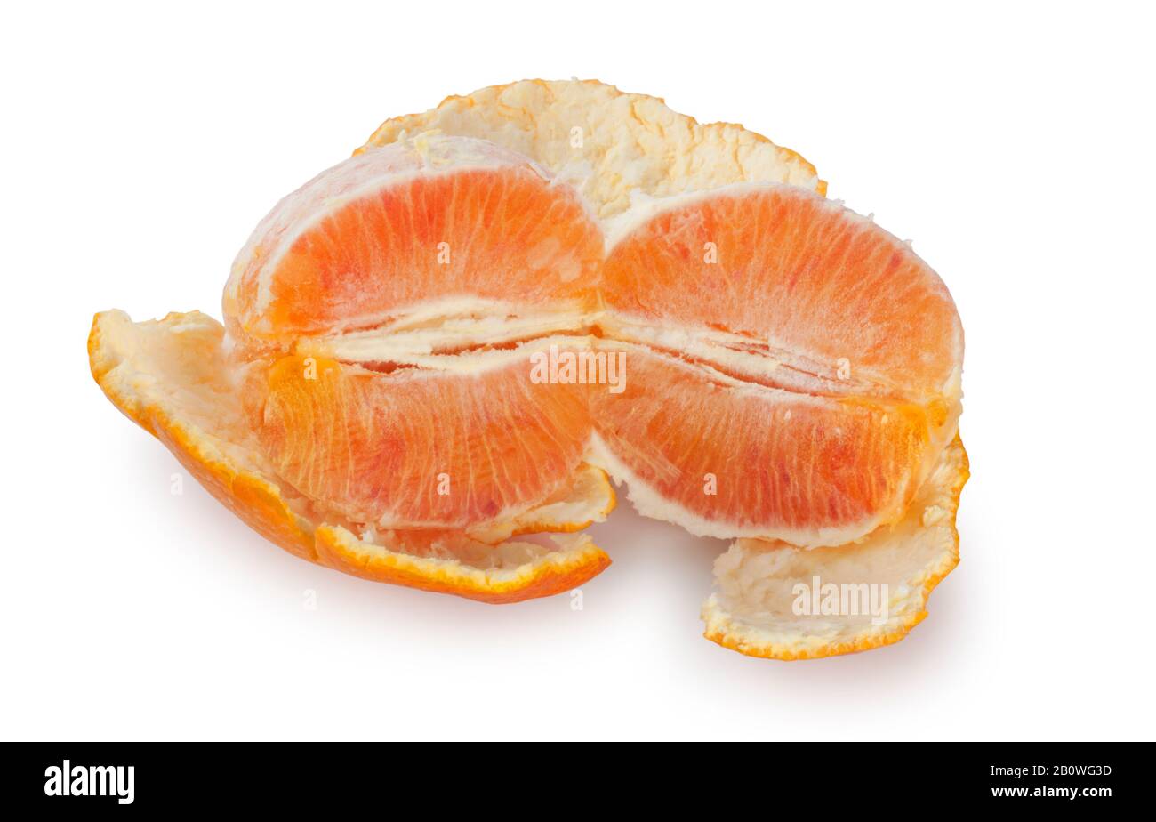 Studio shot of an orange in the process of being peeled cut out against ...