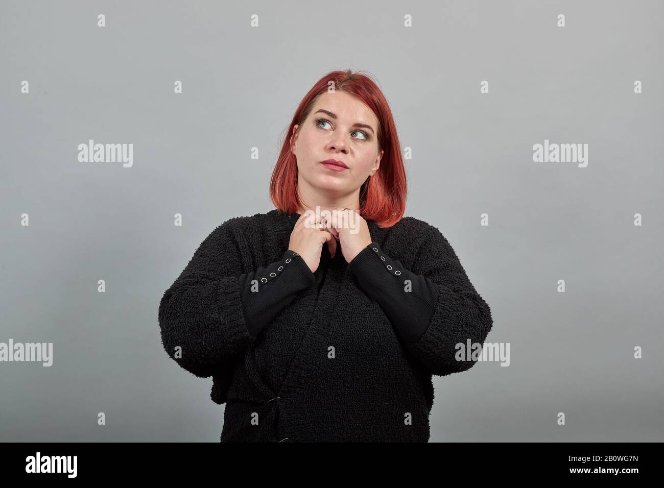 redhead fat lady in black sweater stylish woman sticks a button in ...