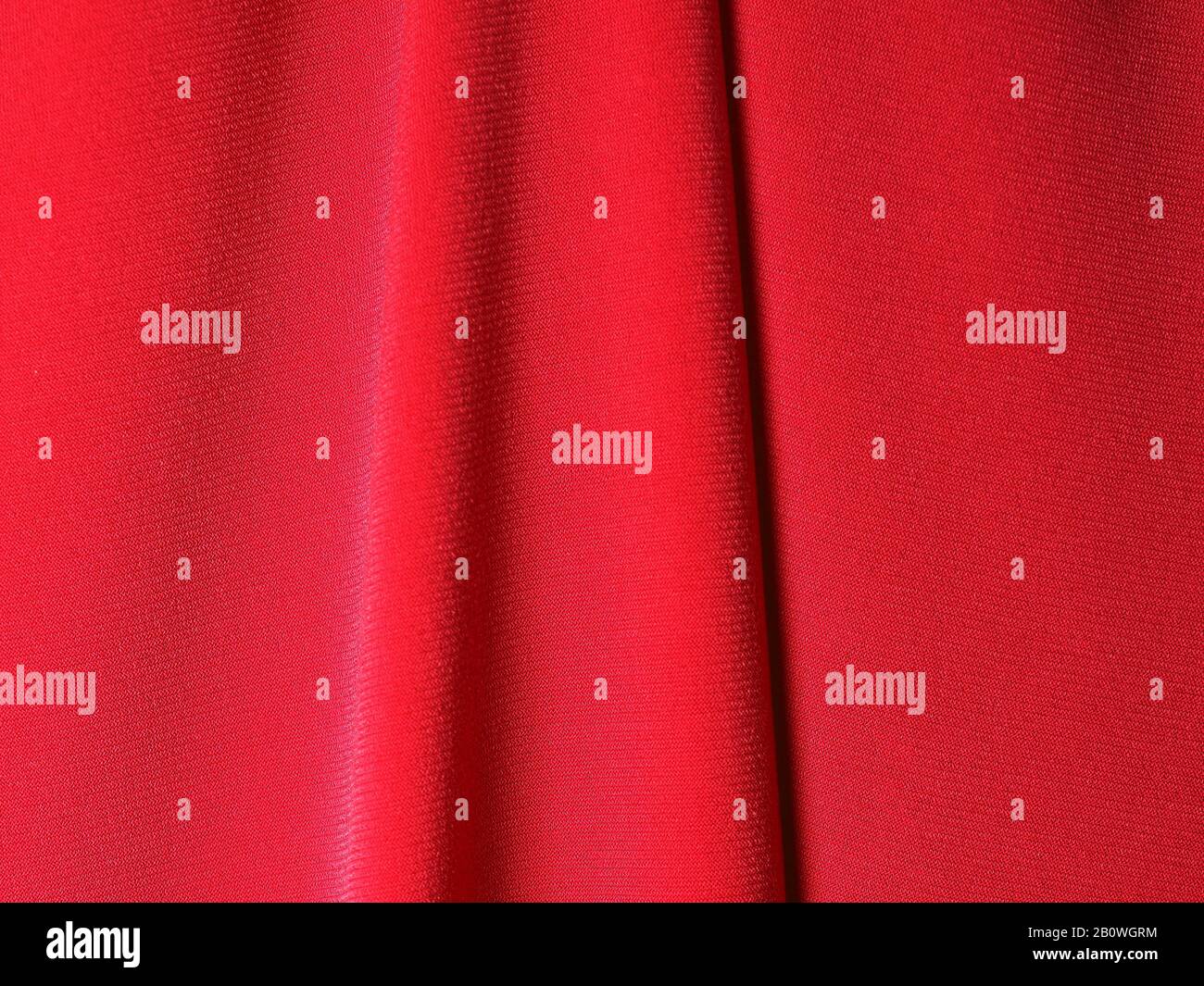 red fabric curtain used in a theatre Stock Photo - Alamy