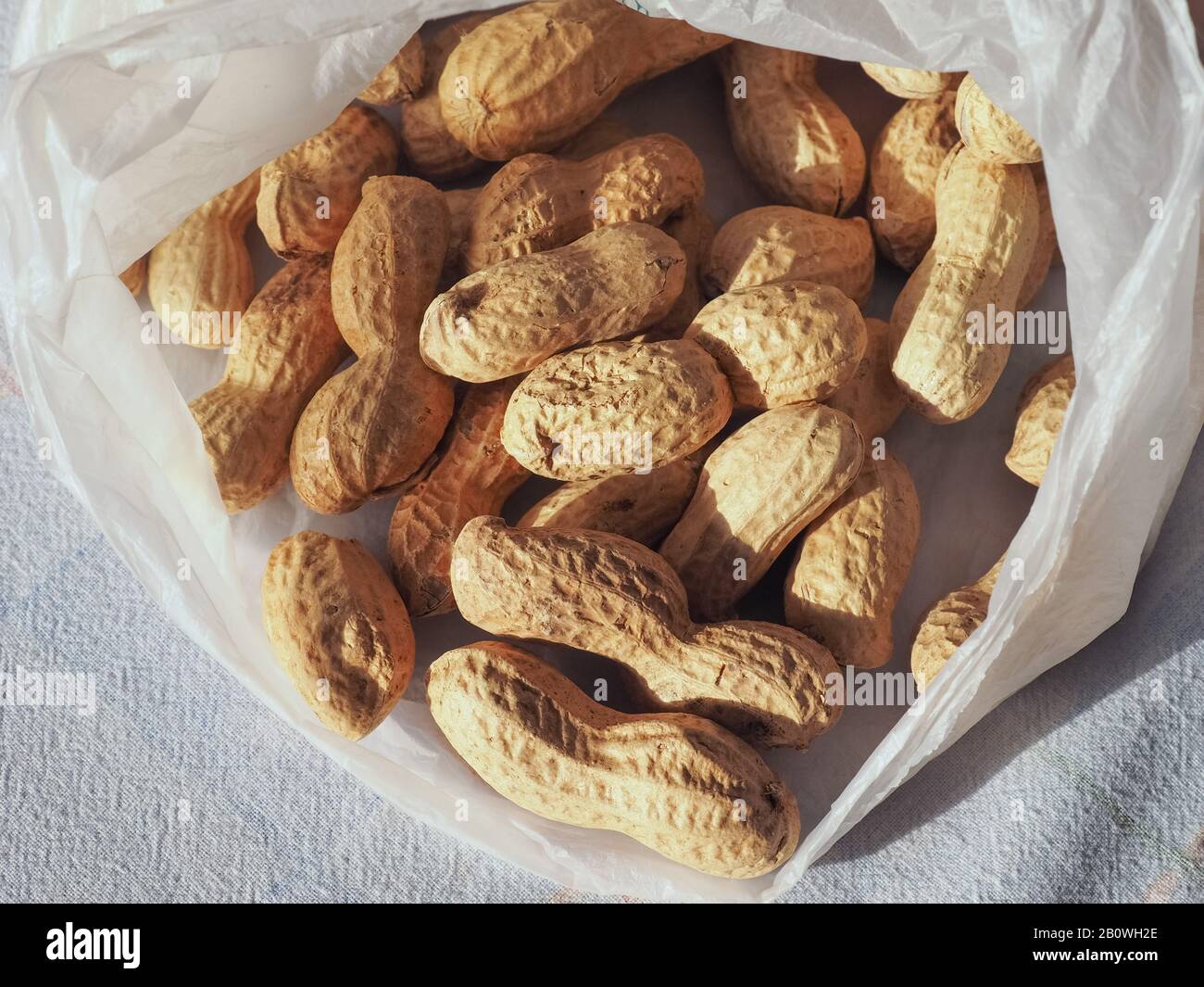 Peanuts in plastic bag hi-res stock photography and images - Alamy