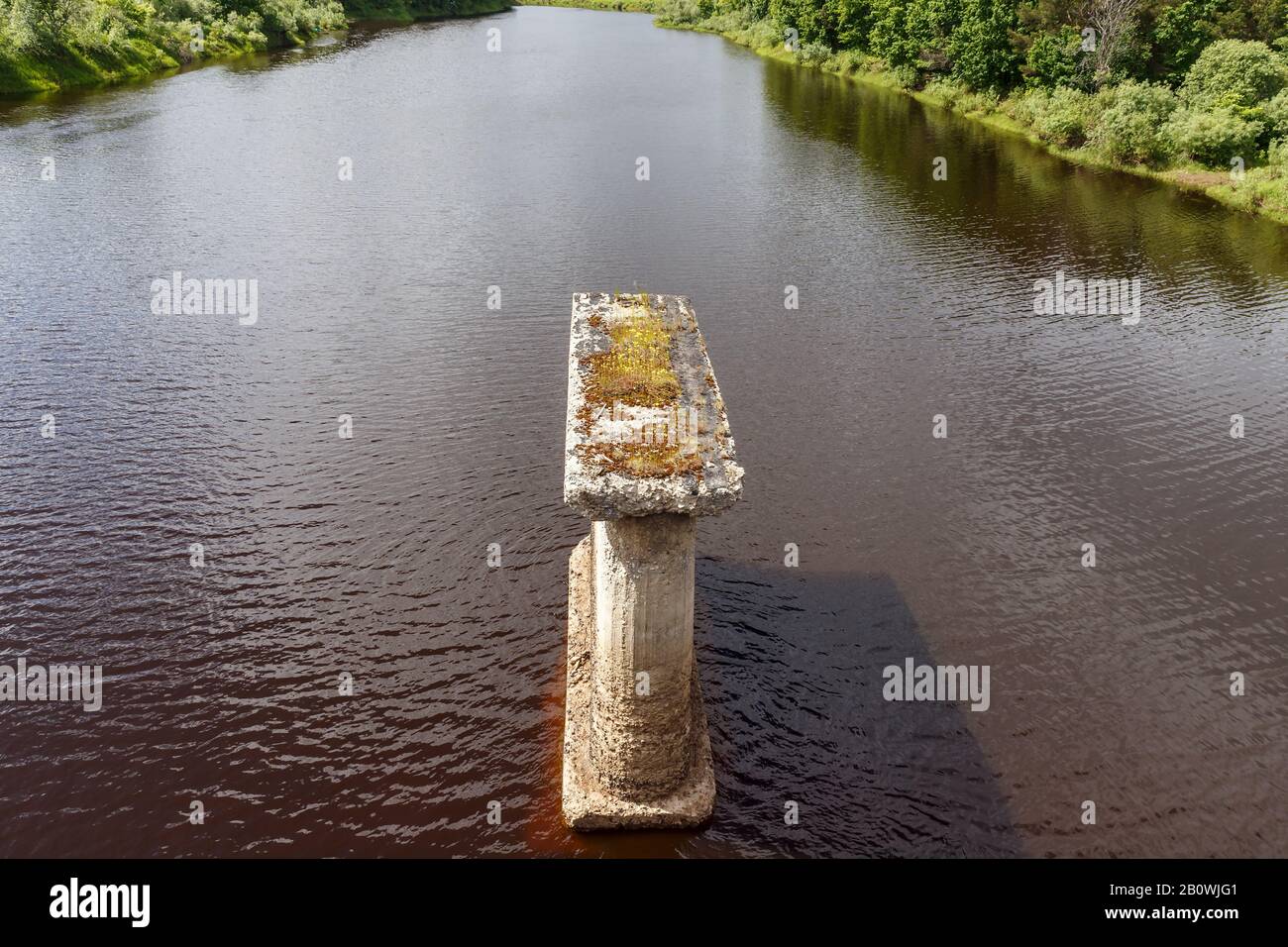Old bridge support, support of the destroyed bridge stands in the river ...